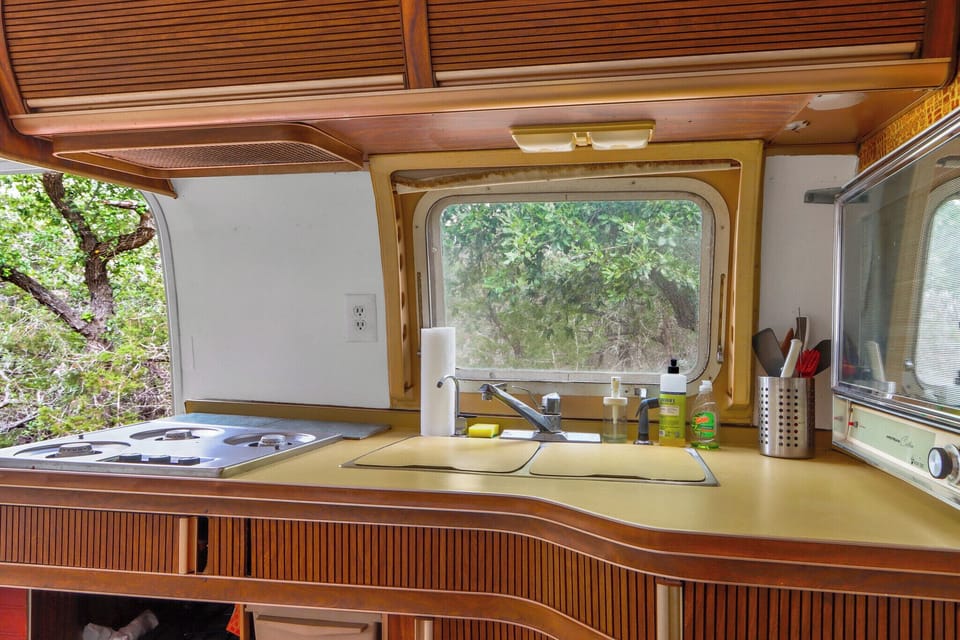 The Driftwoods - Vintage Blue Airstream for Unique Driftwood Getaway ...